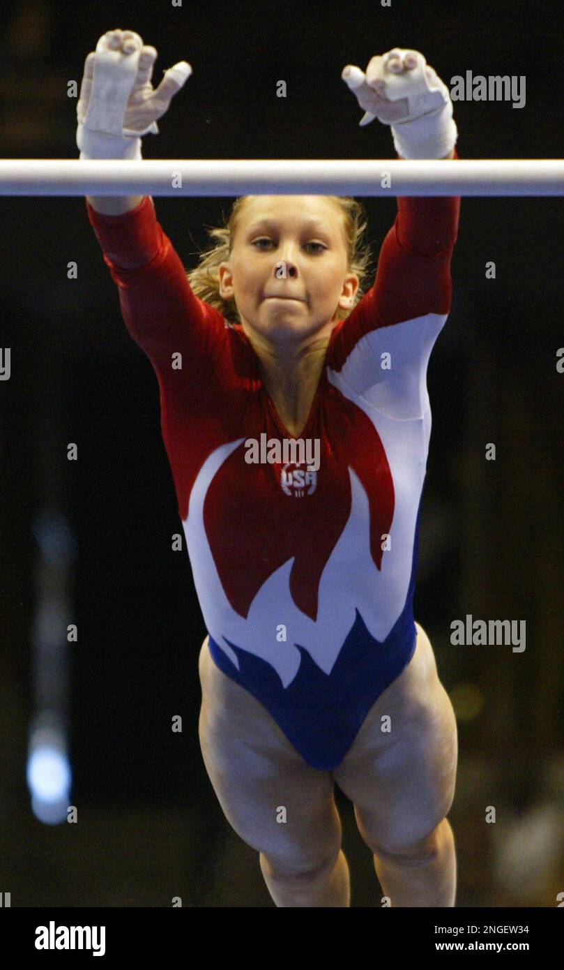 Hollie Vise of Dallas competes in the uneven bars during the women's ...