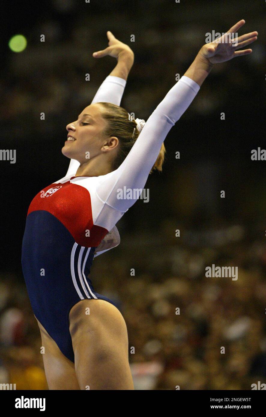 Carly Patterson of Allen, Texas, smiles after completing her vault ...