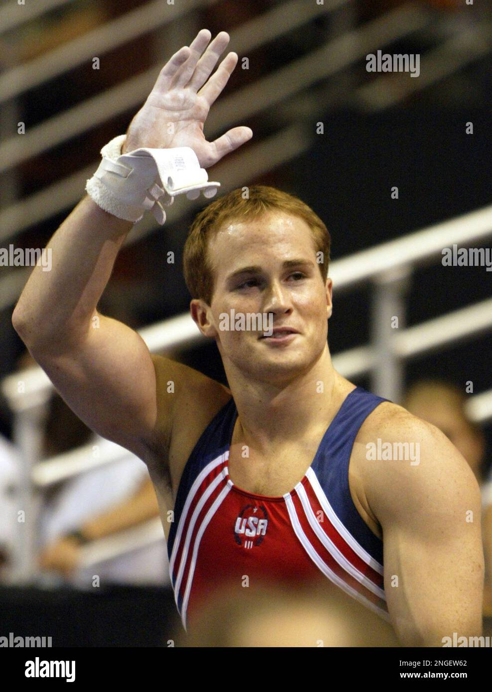 Paul Hamm waves after competing in the still rings during the men's final round of the U.S ...