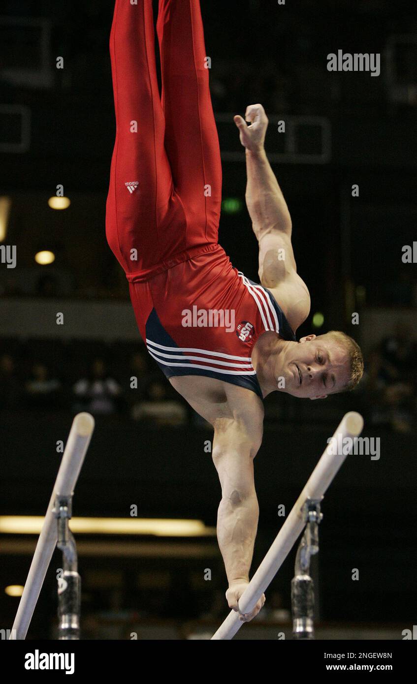 Jason Gatson performs on the parallel bars during the final round of ...