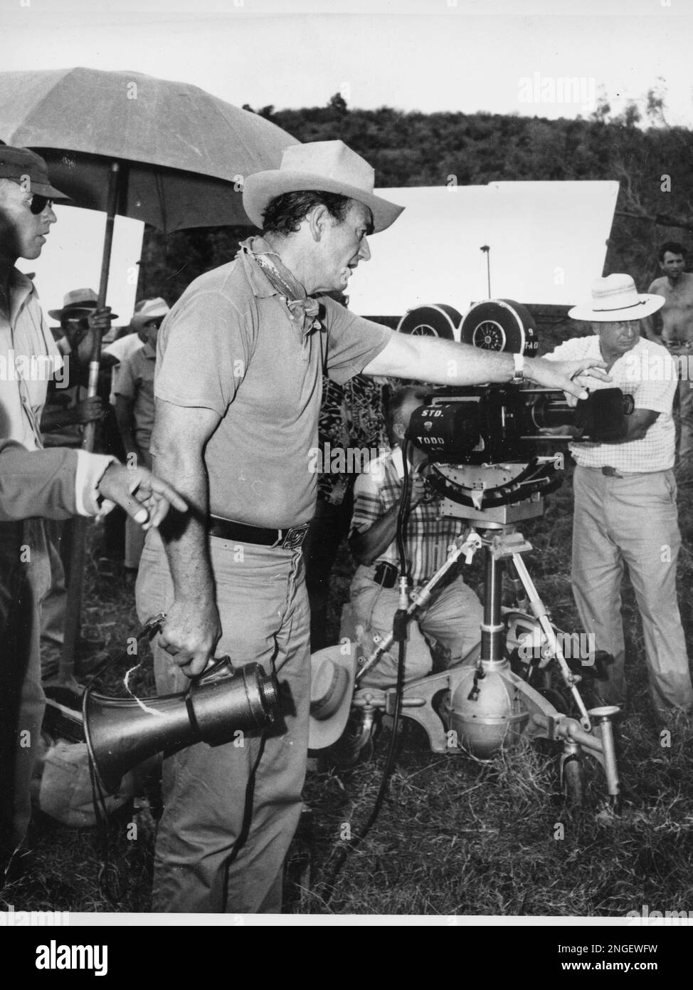 Actor John Wayne directs a scene for the Hollywood movie "The Almo" with the Todd A-O camera ...