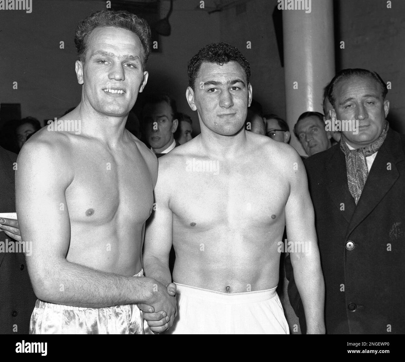 British boxer Henry Cooper, left, shakes hands with Welshman Joe ...