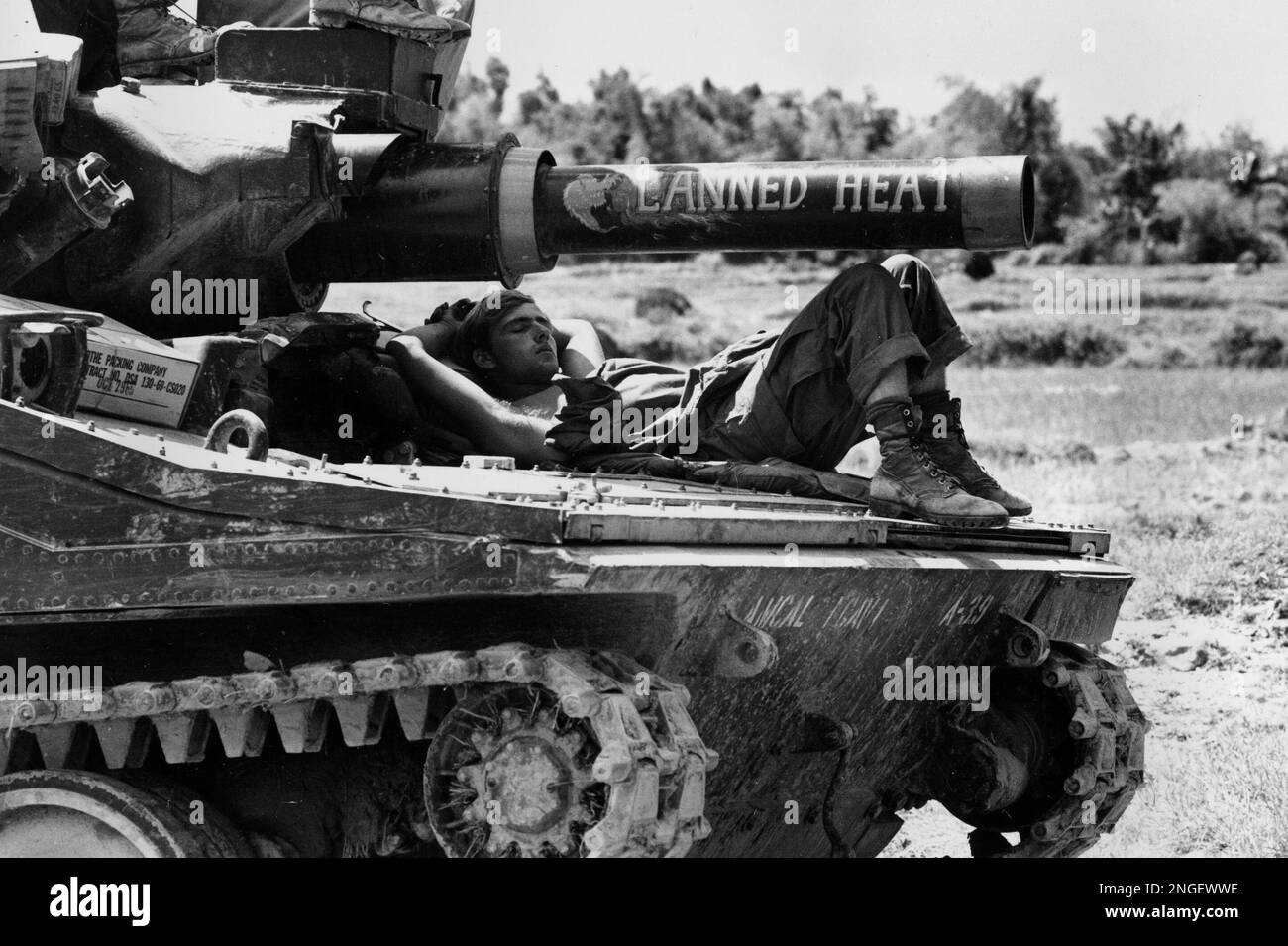 An unidentified trooper of the Americal Division takes a midday nap ...