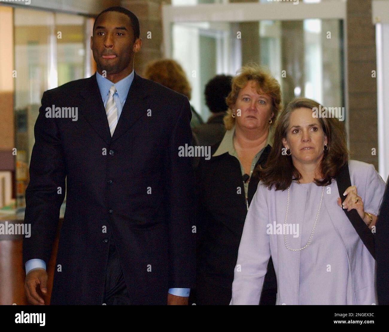 NBA star Kobe Bryant, left, arrives at the Eagle County Courthouse with ...