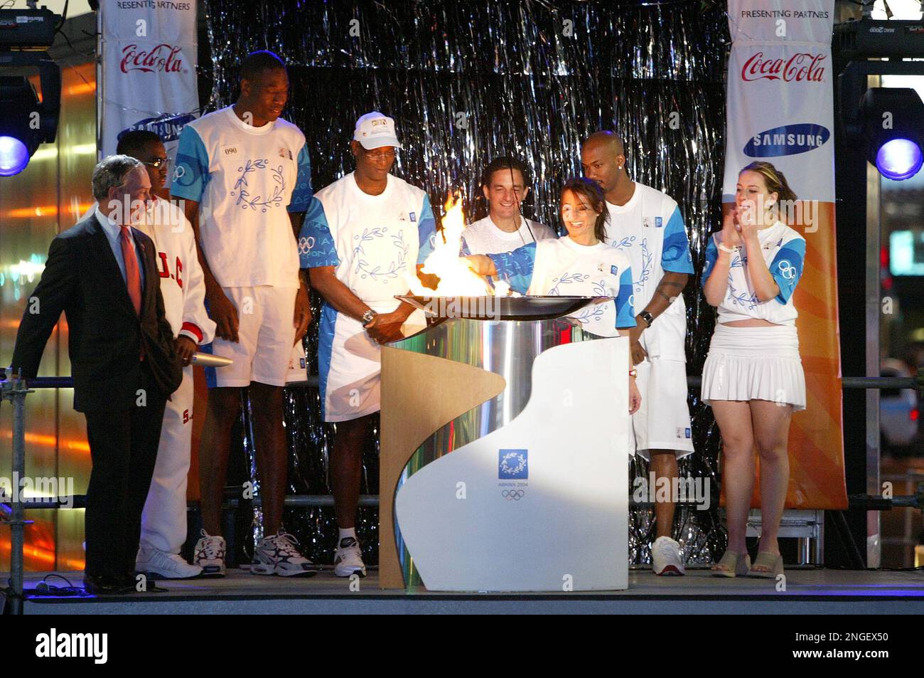 Olympic gymnast Nadia Comaneci, third from right, lights the Olympic ...