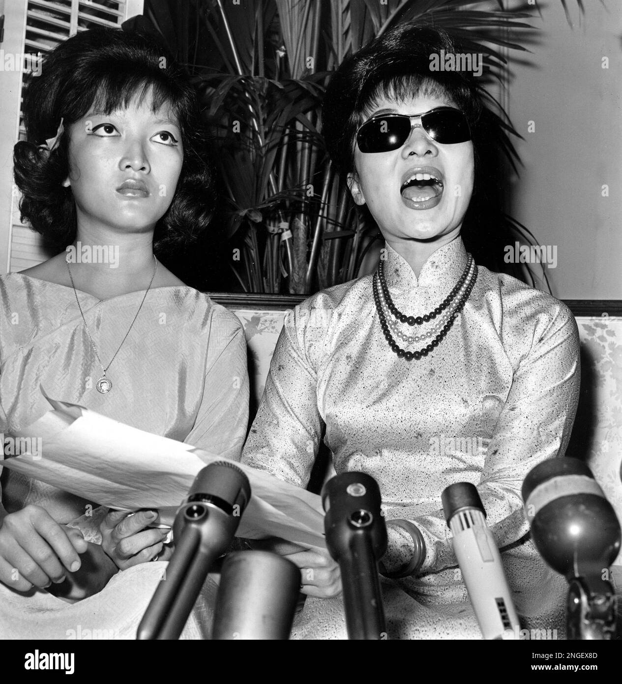 Mrs. Ngo Dinh Nhu, right, speaks at a news conference in Beverly Hills, Calif., November 2, 1963 ...