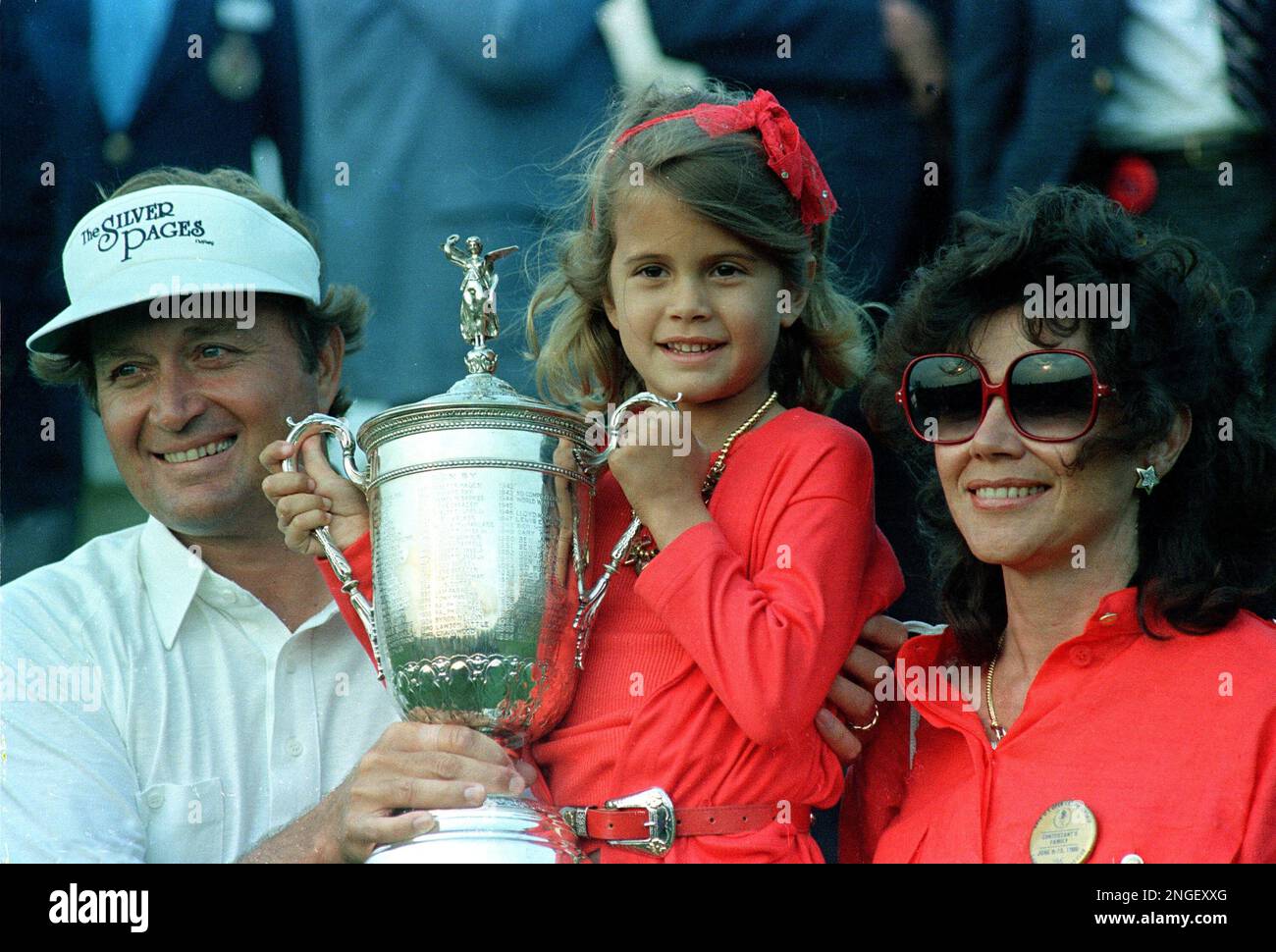 Golfer Ray Floyd, left, holds the U.S. Open Championship trophy cup as ...