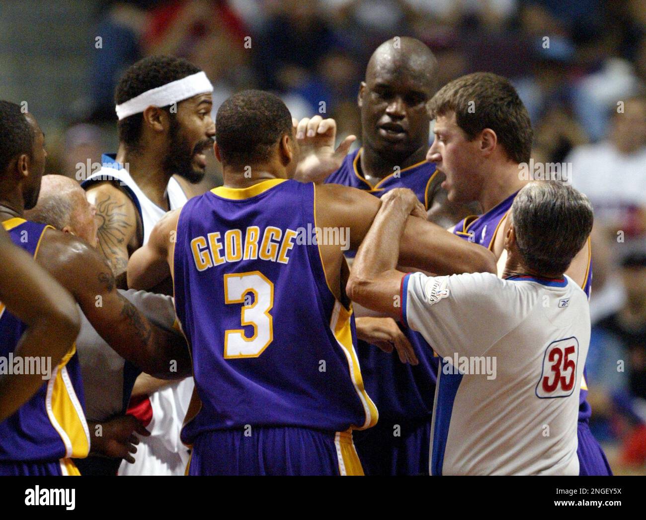 Los Angeles Lakers guard Devean George (3) helps separate forward Slava ...