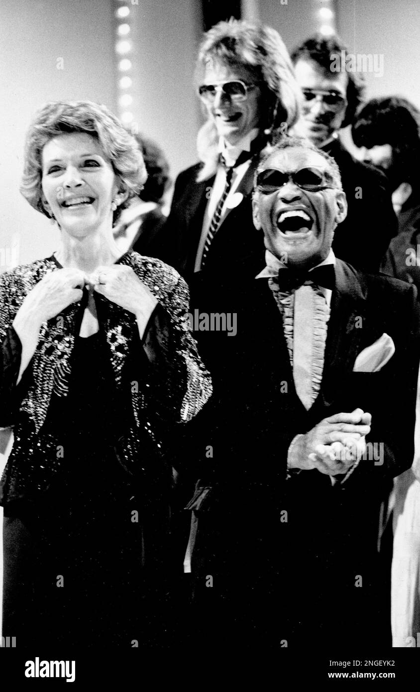 First lady Nancy Reagan, left, gets a laugh with Ray Charles, right ...