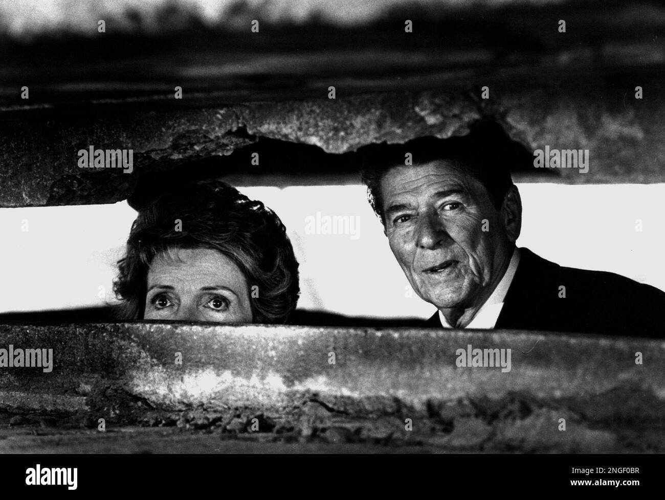 President Ronald Reagan and first lady Nancy Reagan peer out of a World ...