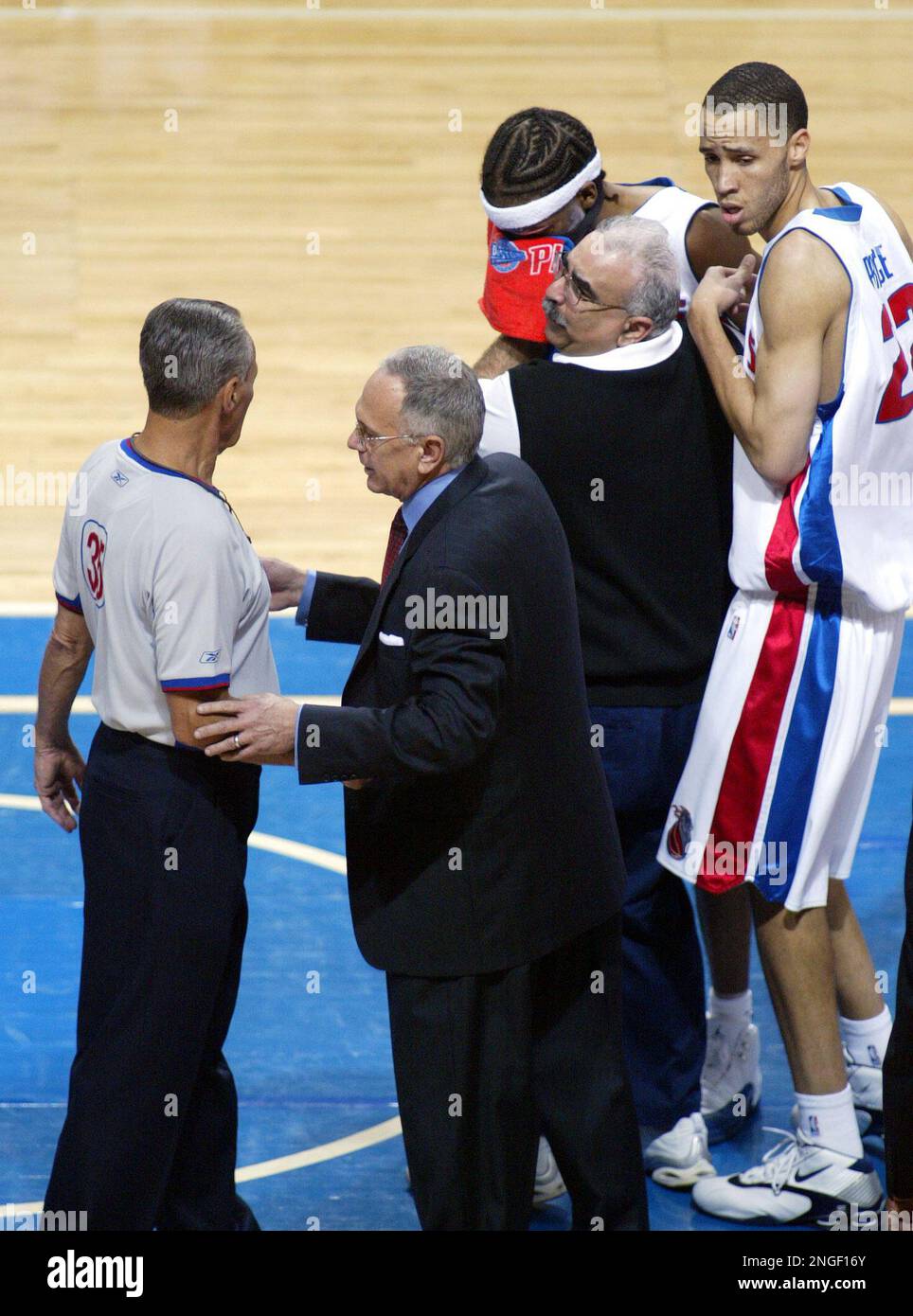 Detroit Pistons head coach Larry Brown, center, talks to referee Jack ...