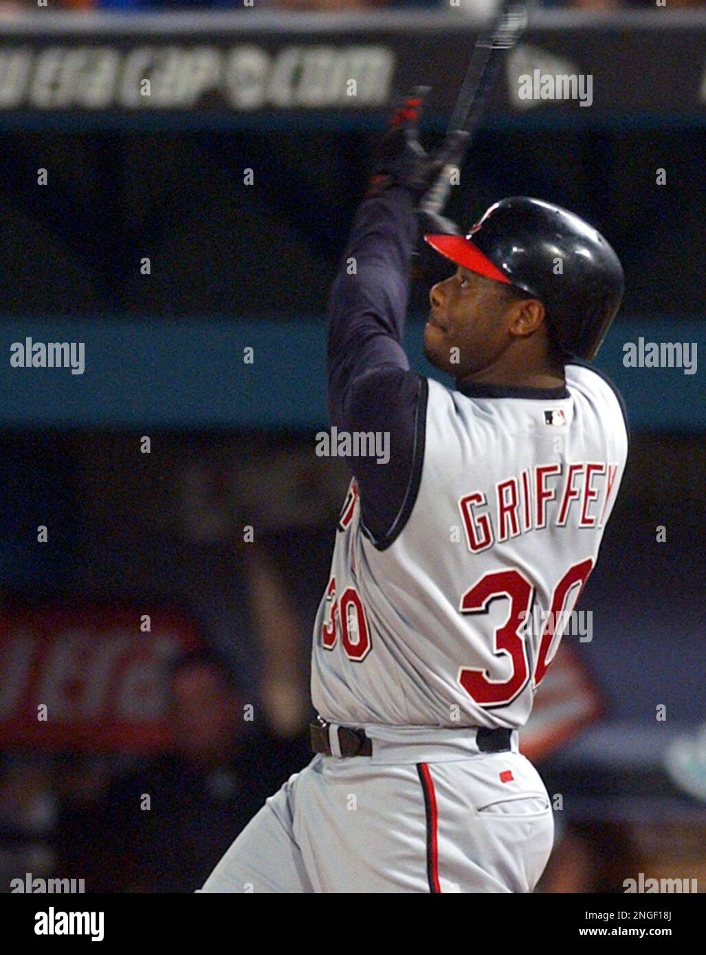 Cincinnati Reds' Ken Griffey Jr. watches the flight of his home run off ...