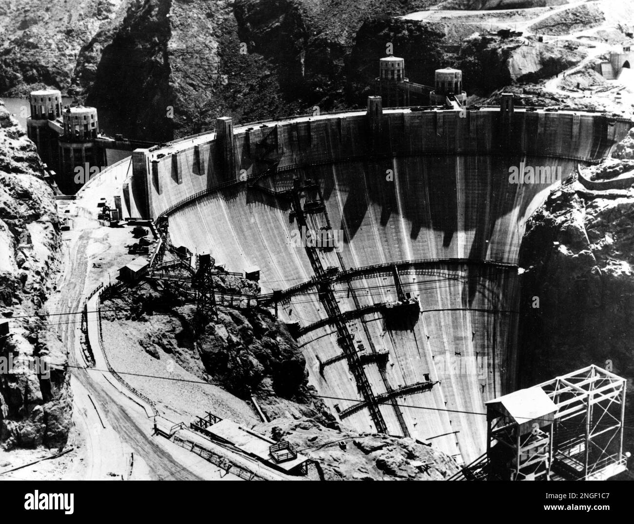 This aerial view shows a crest of the Hoover Dam, aka Boulder Dam ...