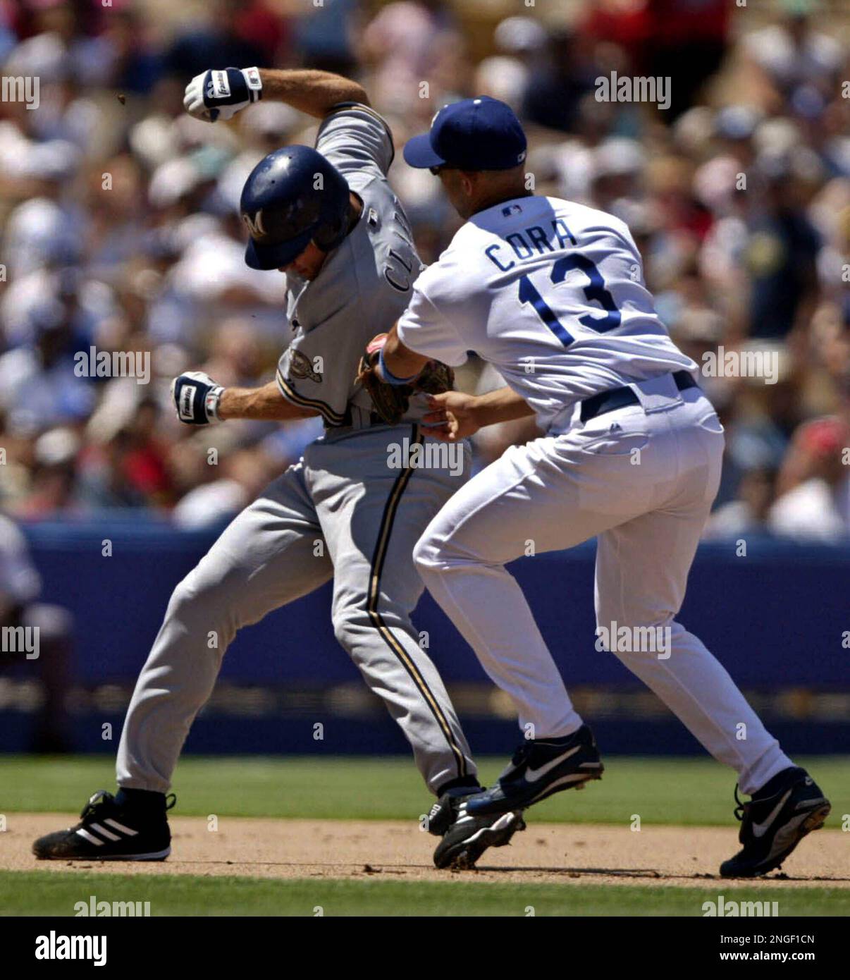 Milwaukee Brewers' Brady Clark, left, is caught in a rundown by Los ...