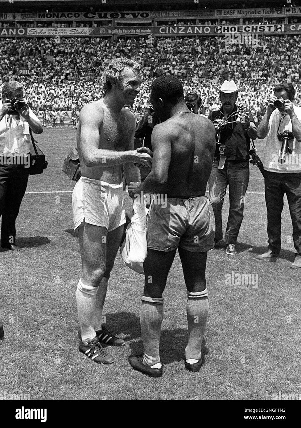 England's captain Bobby Moore, left, exchanges shirts and shakes hands ...