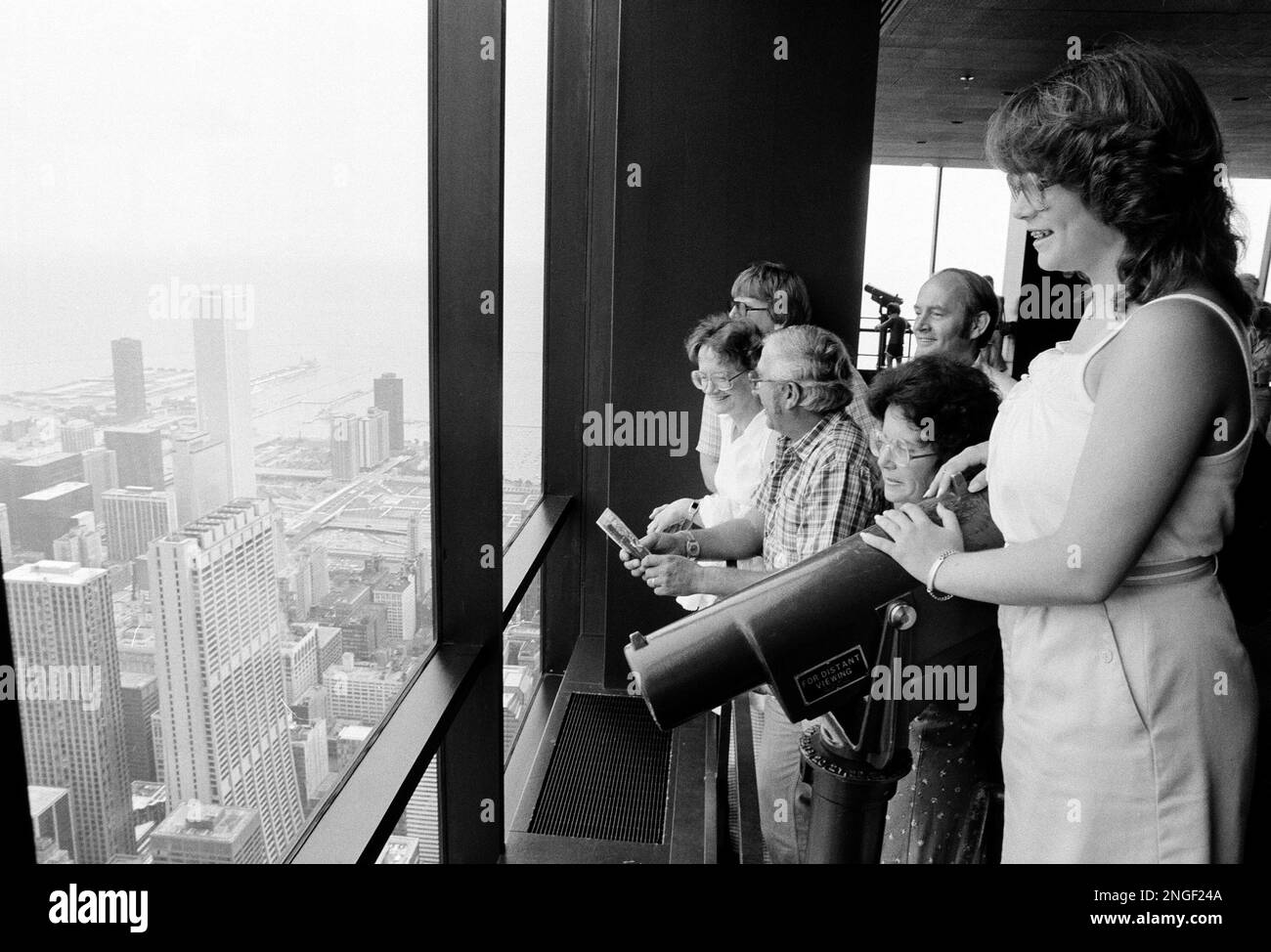 People gaze at the Chicago skyline from the 103rd floor observatory at ...