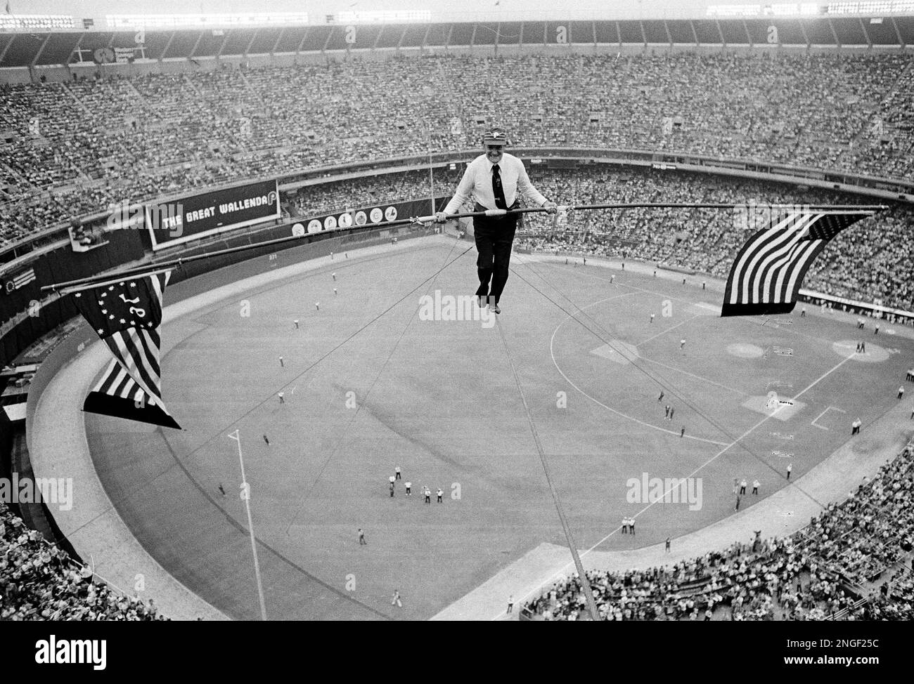 Karl Wallenda, 71, walks on a cable 200 feet above the playing field at ...
