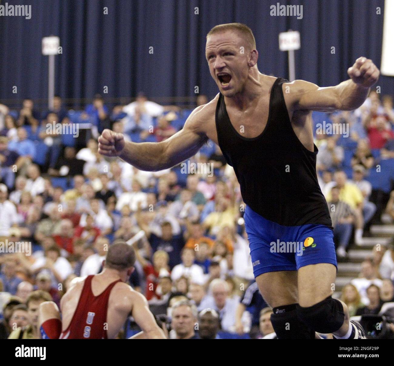 Dennis Hall, right, of Plover, Wis. celebrates his win over Brandon ...