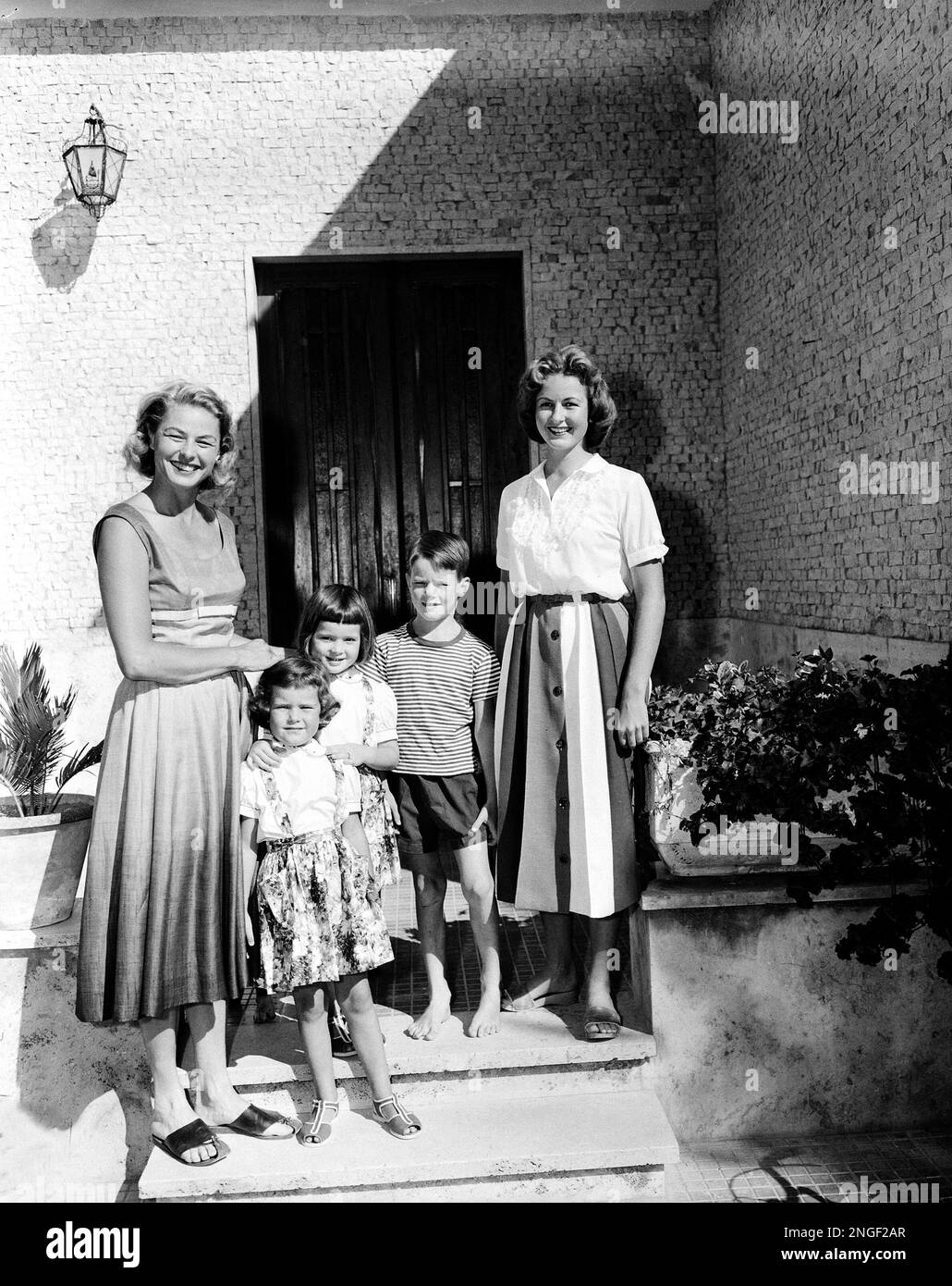 Actress Ingrid Bergman is shown with her children outside her villa at ...