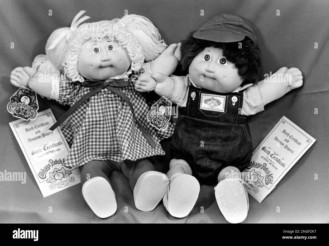 Two Cabbage Patch Kids dolls are shown in a window display at Cartier's ...