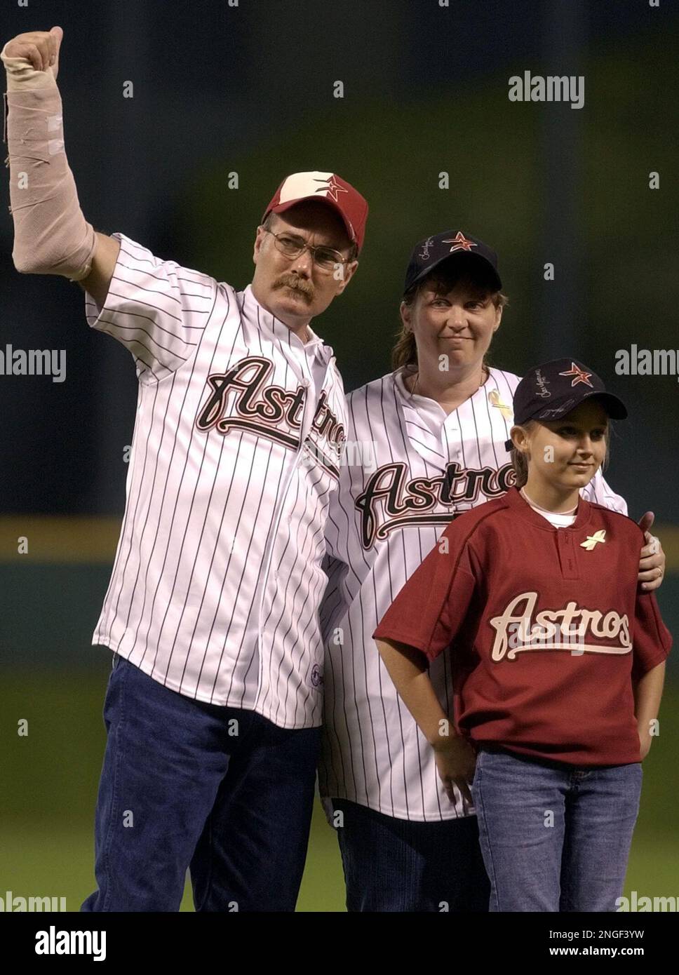 Former Iraq hostage Thomas Hamill stands with his wife Kellie and ...