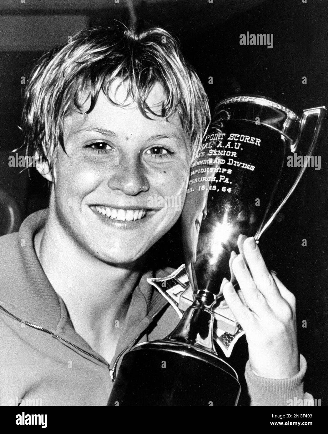 Donna de Varona of Santa Clara Swim Club hugs the trophy she won for ...