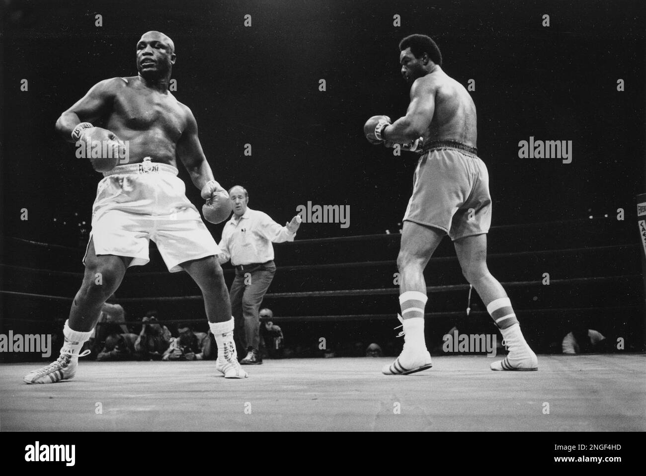 Joe Frazier, left, reels from a blow by heavyweight champion George ...