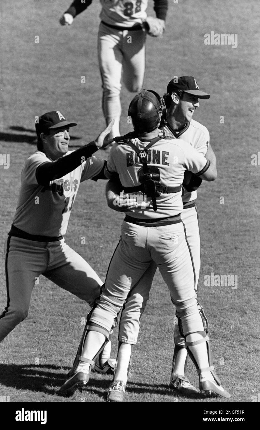 California Angels pitcher Mike Witt gets a hug from catcher Bob Boone ...