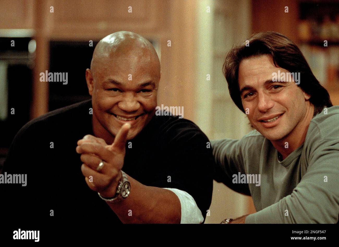 Former heavyweight boxing champion George Foreman, left, and actor Tony ...