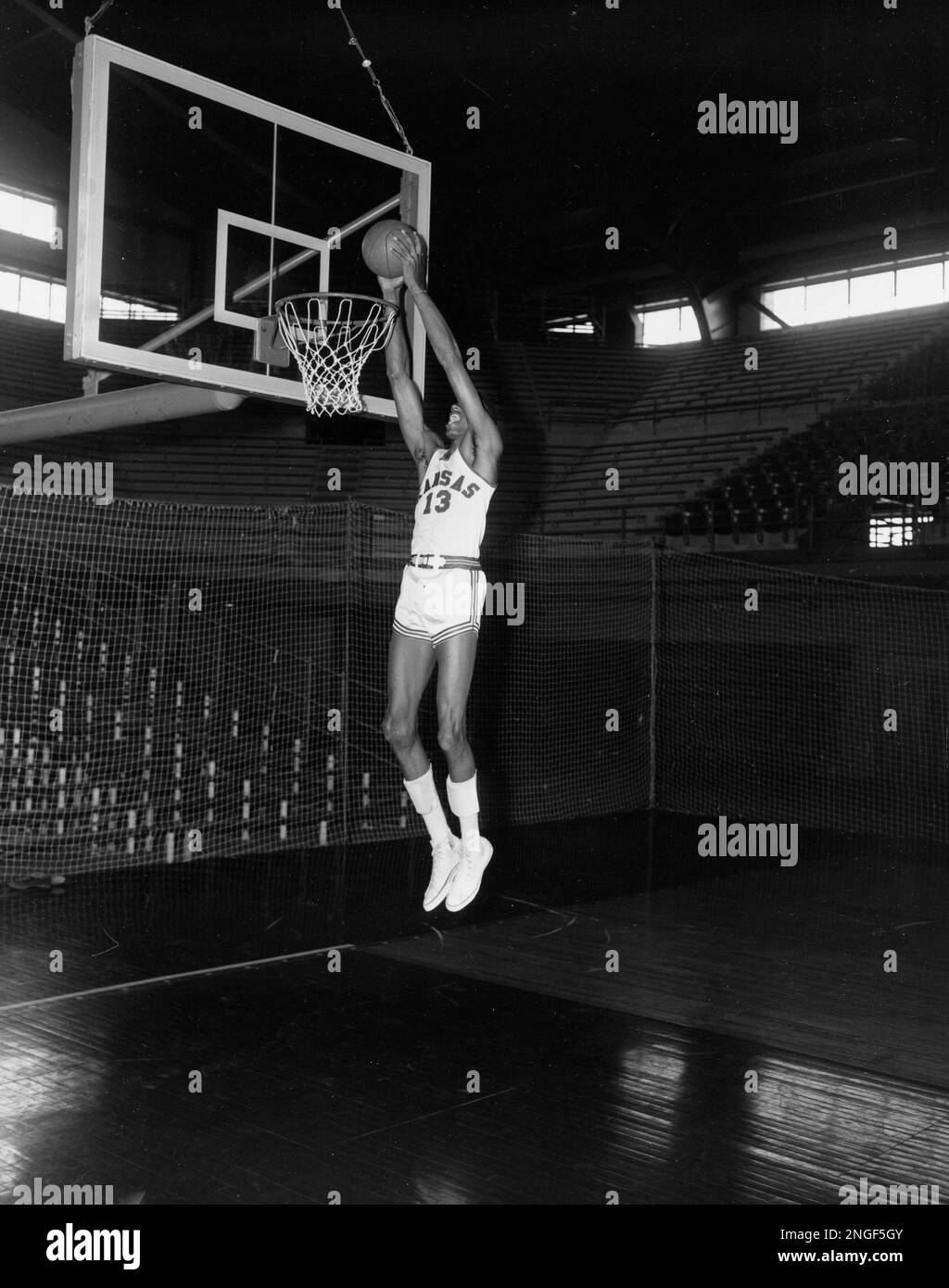 Wilt Chamberlain, 7-foot star player of Kansas University, shows his ...