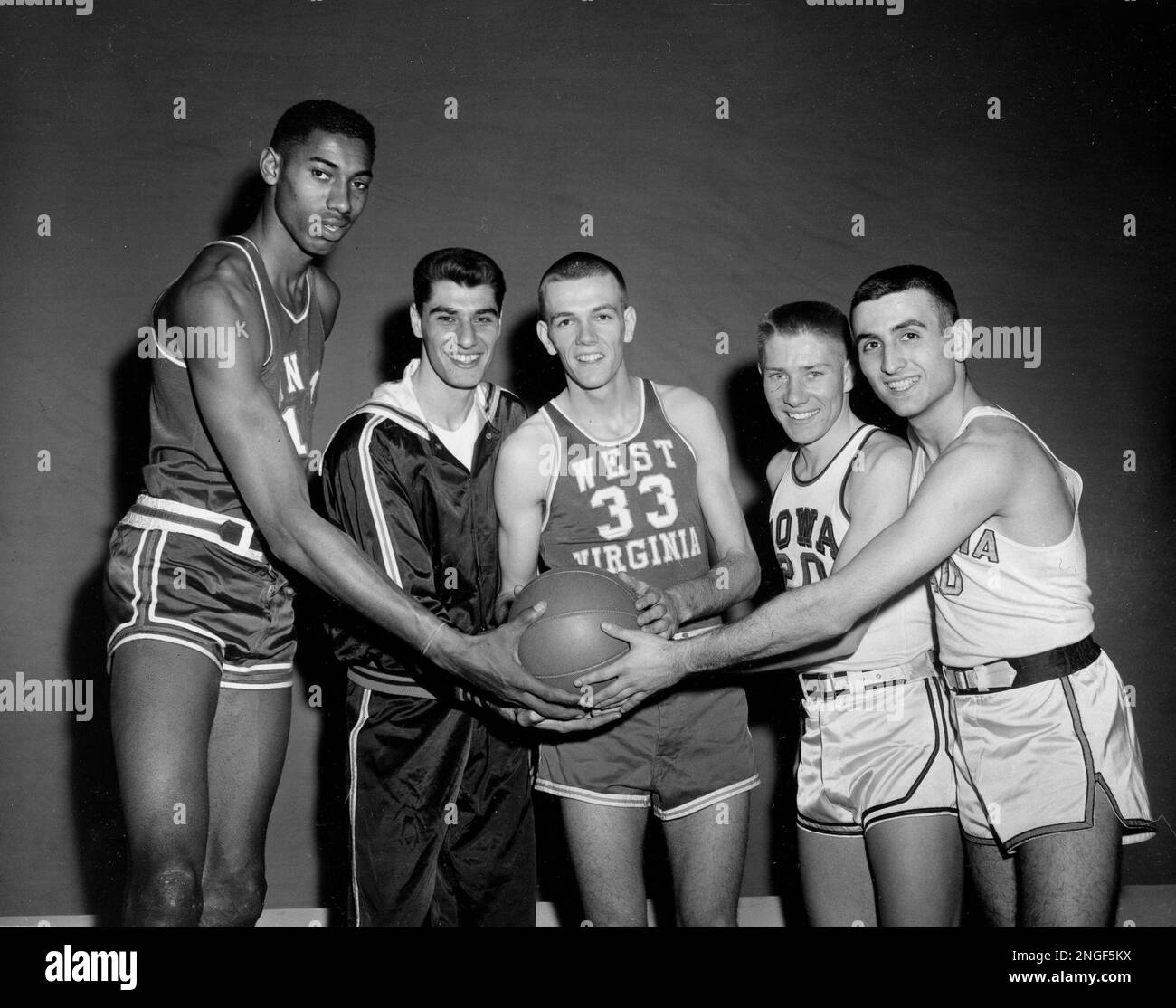 Players of the Associated Press All America Basketball Five are shown ...
