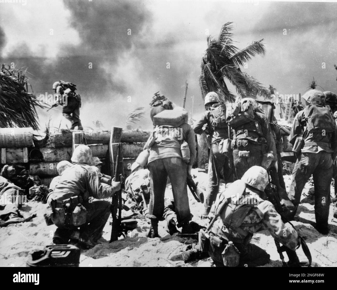 U.S. Marines storm the Japanese-held airfield at Tarawa atoll in late ...