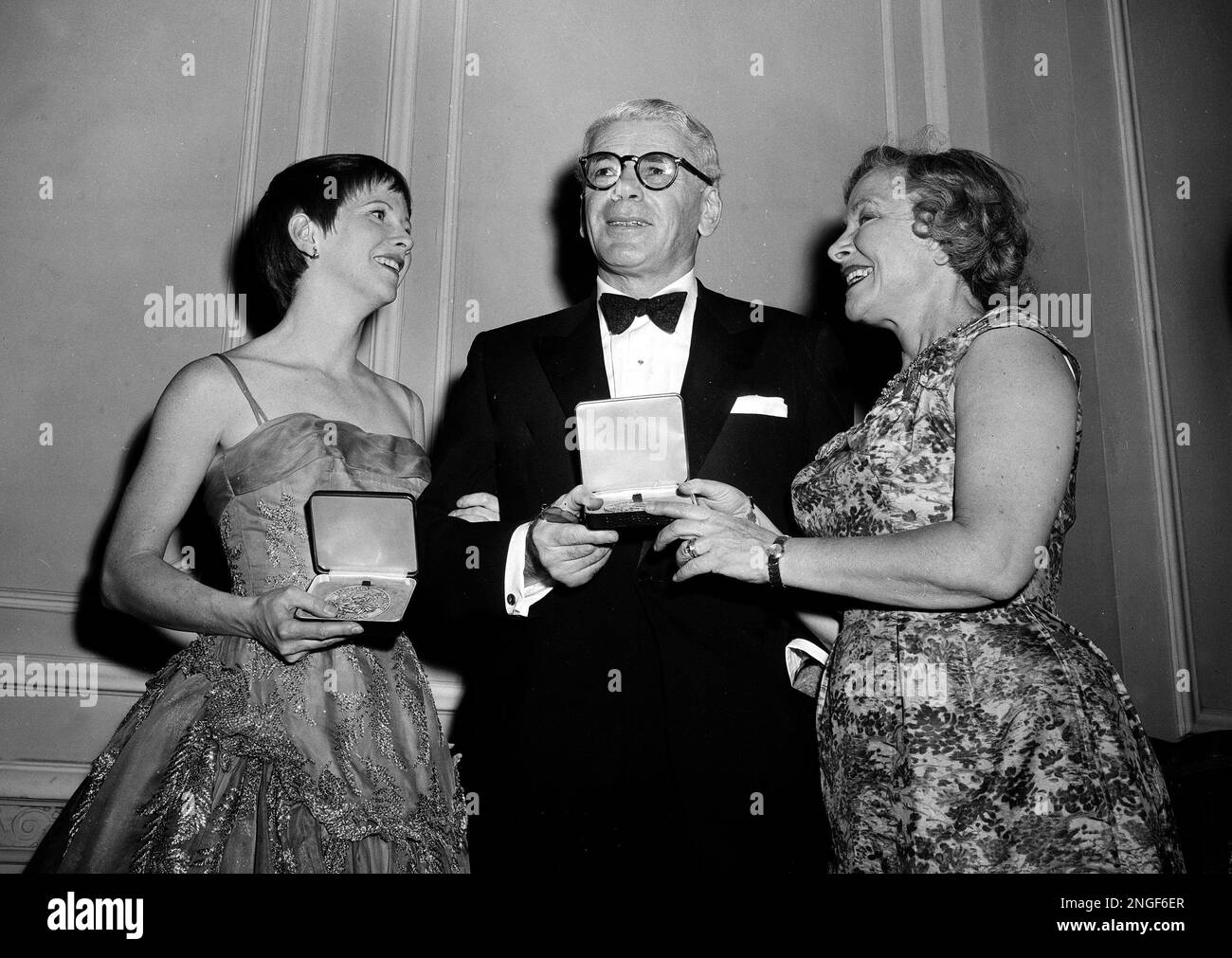 Actress Julie Harris, left, and actor Paul Muni, center, pose with ...
