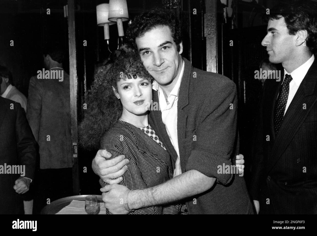 Mandy Patinkin, right, embraces his co-star Bernadette Peters at Sardi's restaurant in New York ...