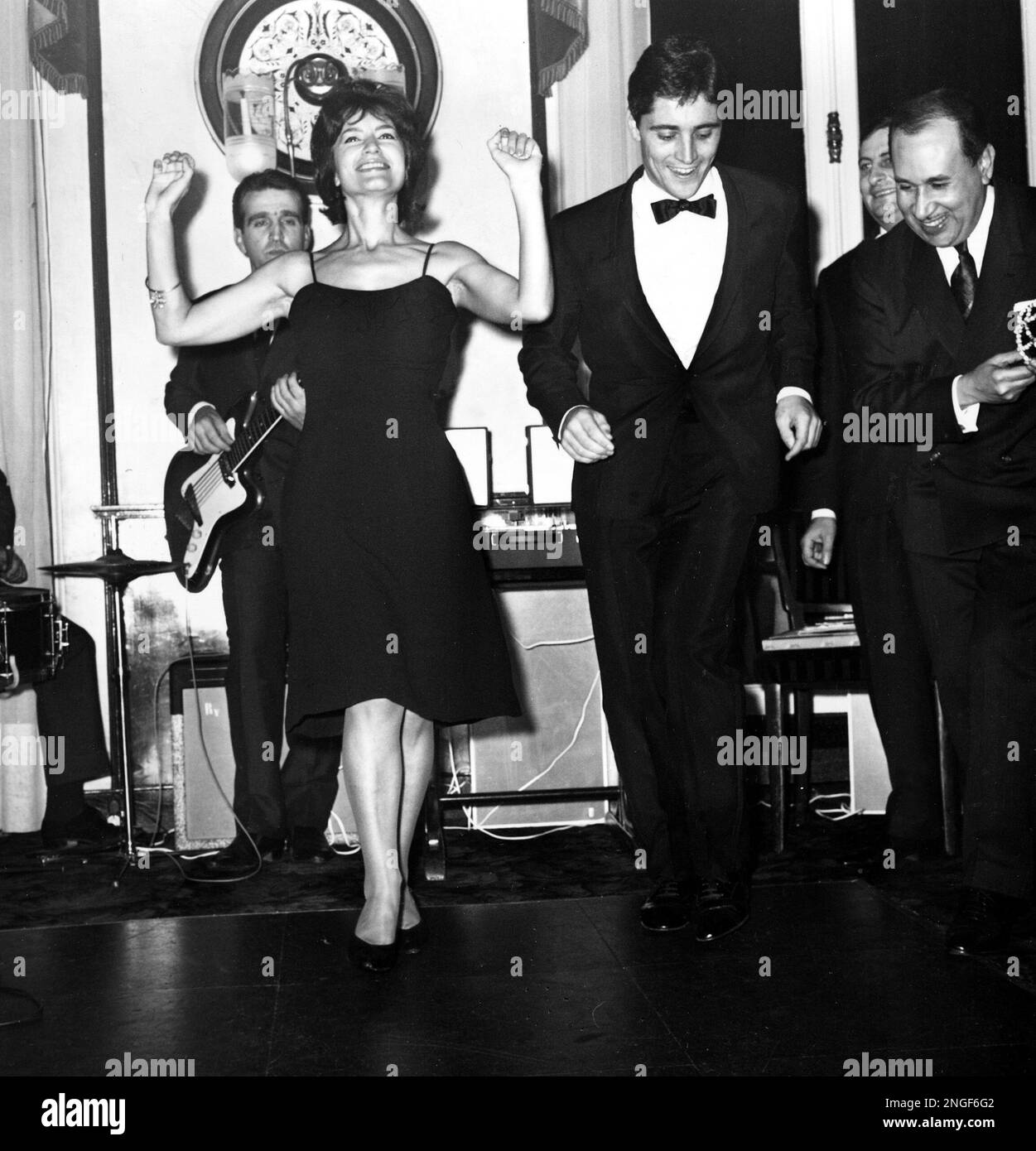 Brazilian singer Laura Villa, left, and French singer Sacha Distel do ...