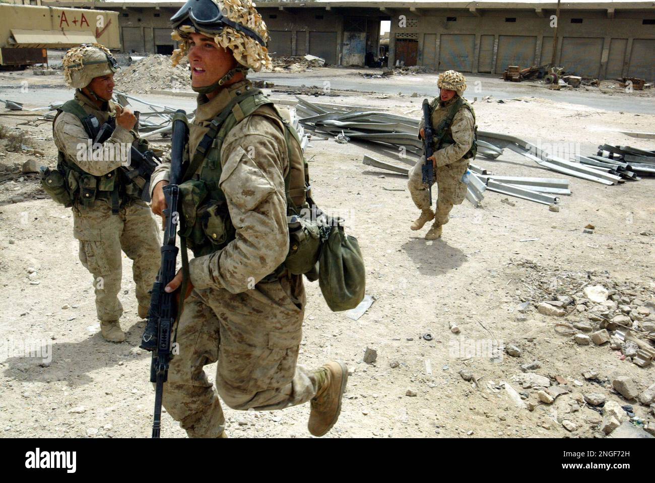 U.S. Marines from Weapons Company of the 1st Battalion 5th Regiment run ...