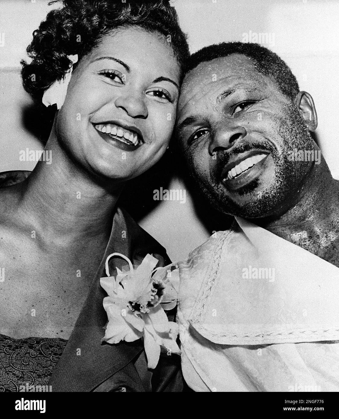 Light heavyweight boxing champion Archie Moore poses with his wife ...