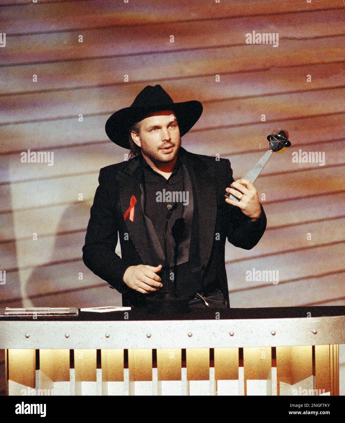 Country music singer Garth Brooks accepts one of the seven awards he ...