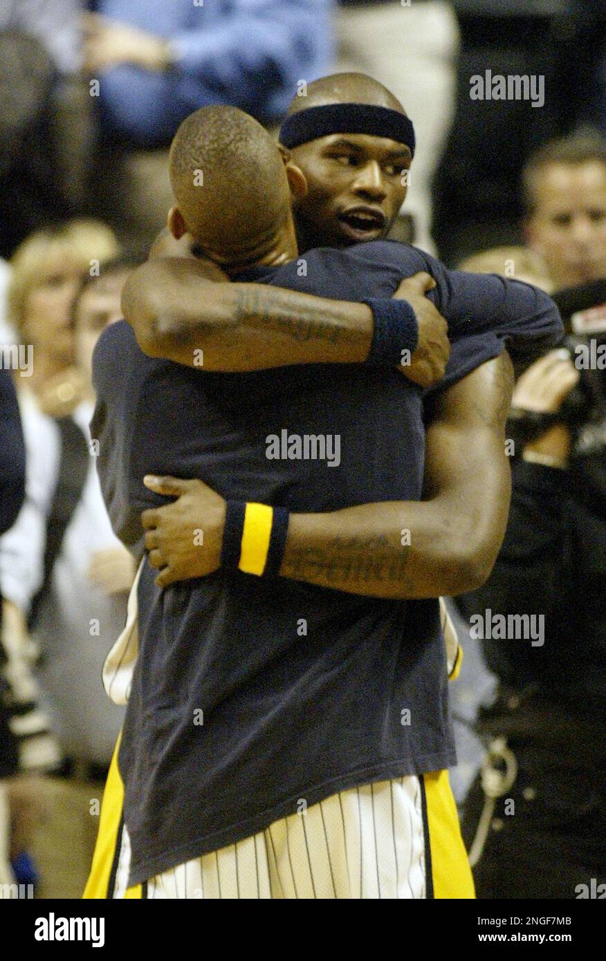Indiana Pacers guard Reggie Miller, front, get a hug from forward Al ...