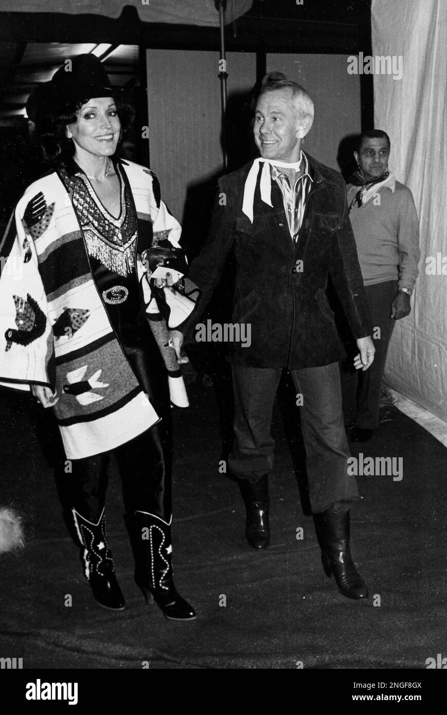 Comedian Johnny Carson and his wife, Joanna, dressed in western-style ...