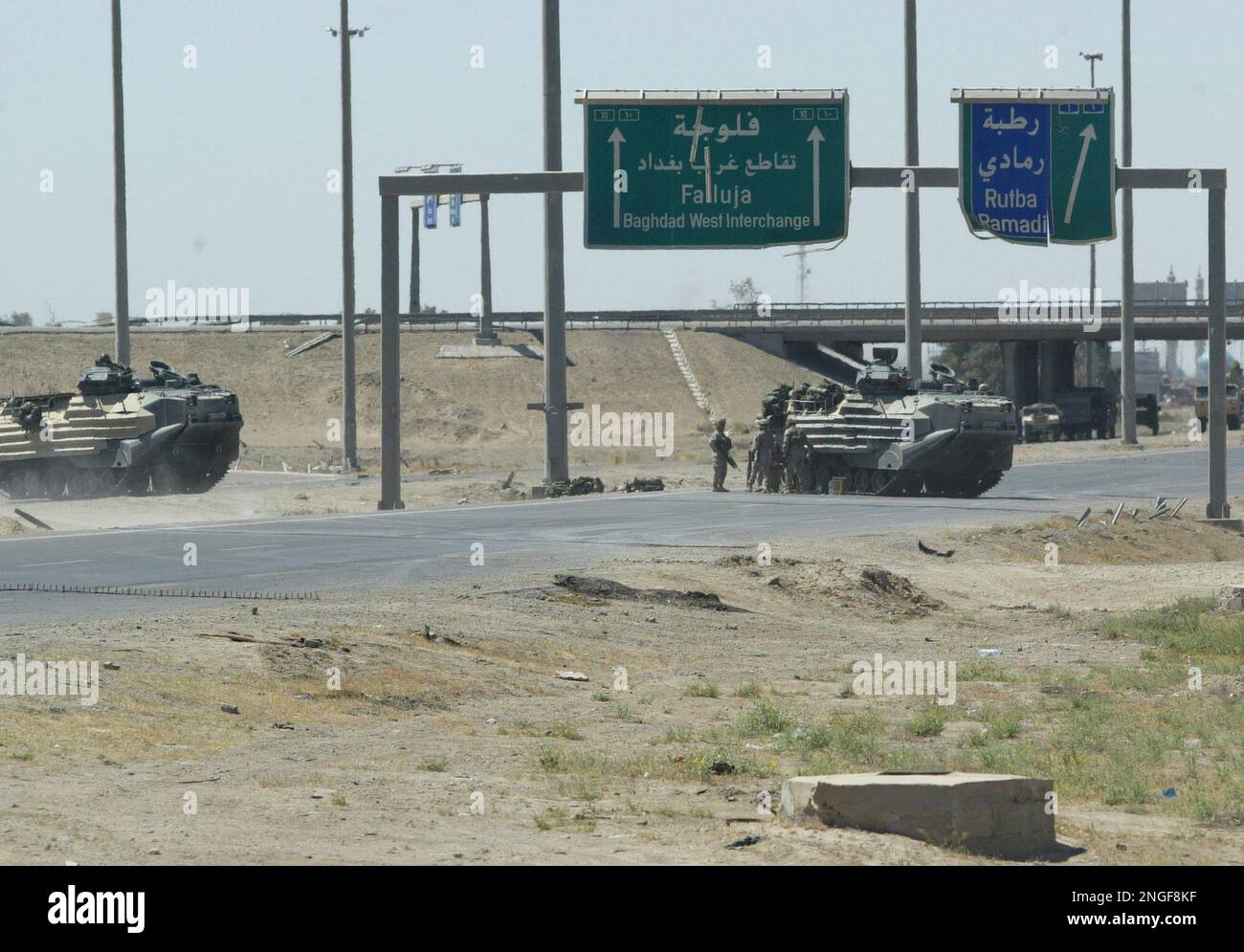 U.S. Marines block the entrance of the city of Fallujah, Iraq, Monday ...