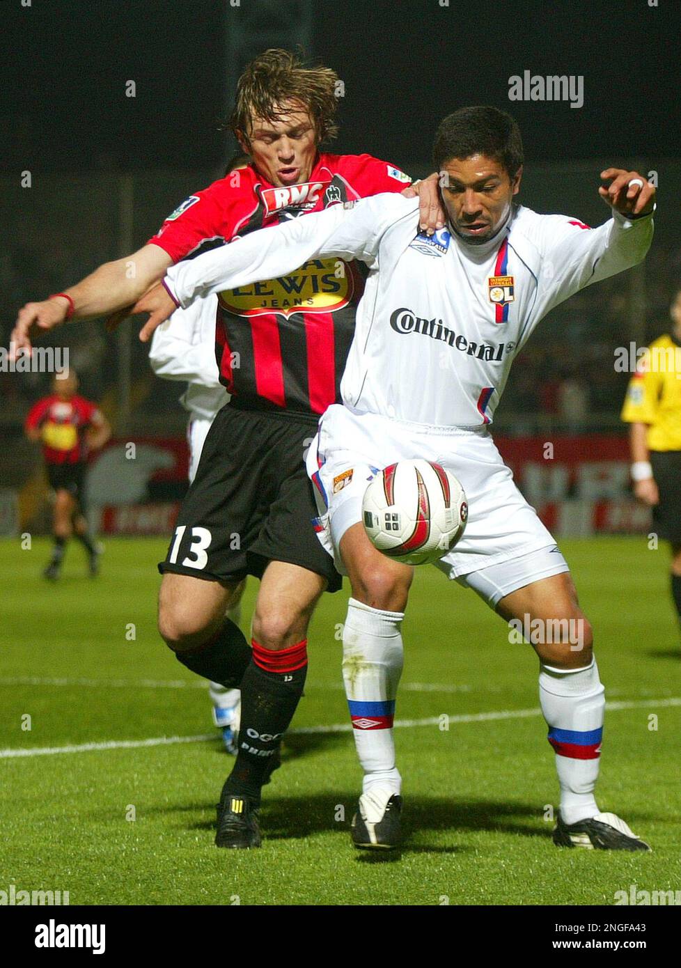 OGC Nice player Jacques Abardonado, left, fights for the ball with ...