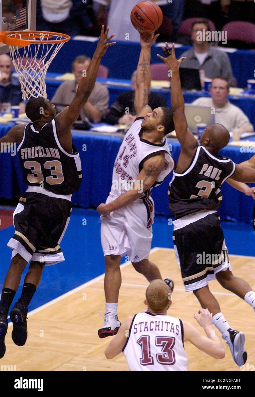 Saint Joseph's Jameer Nelson (14) goes to the basket as Wake Forest's ...