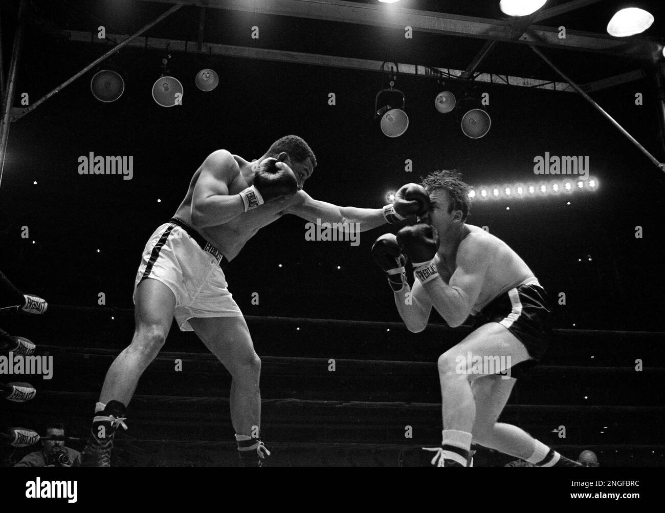 Light heavyweight champion Jose Torres lands a left to the face of ...