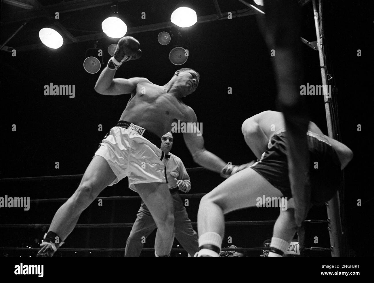 Light heavyweight champion Jose Torres stands over challenger Wayne ...