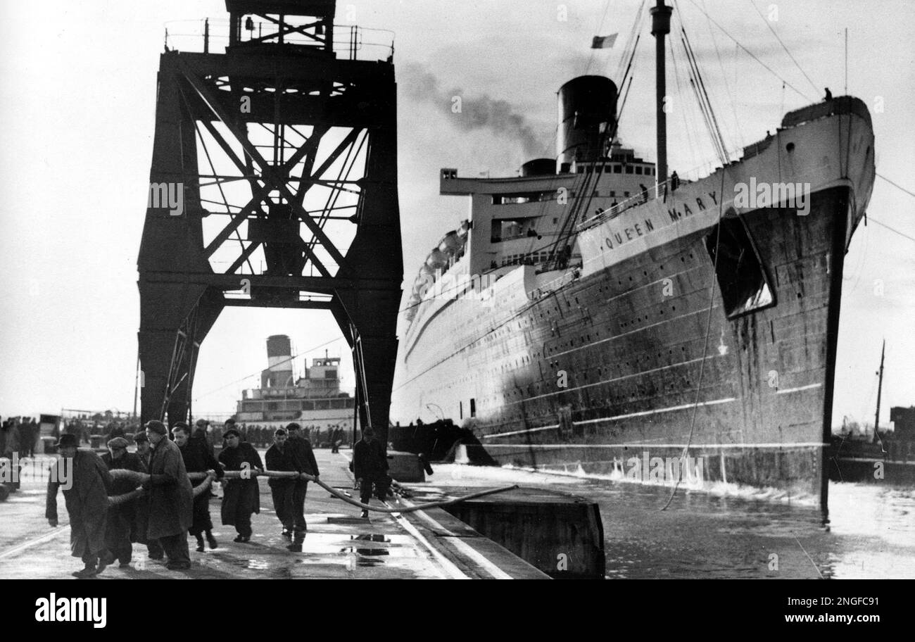 The grand luxury liner Queen Mary is hauled into a dry dock at ...