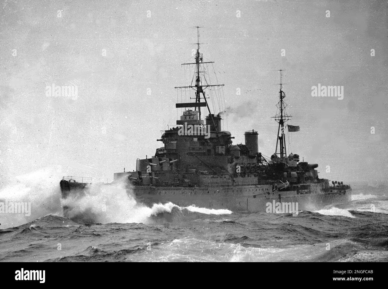 British Fiji class cruiser HMS Kenya on duty in the rough seas of the ...