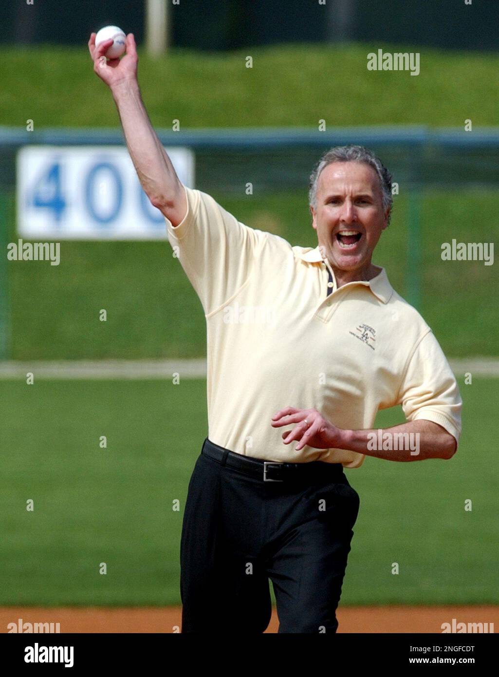Los Angeles Dodgers new owner Frank McCourt throws out the ceremonial ...