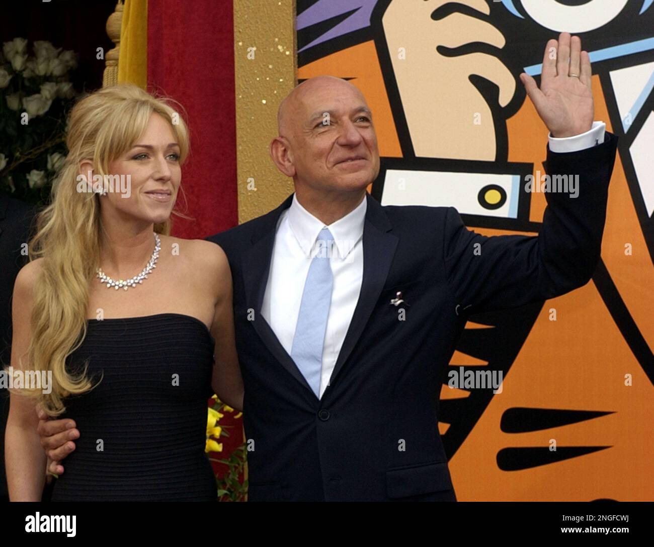 British actor Sir Ben Kingsley waves as he arrives with his wife, Lady ...