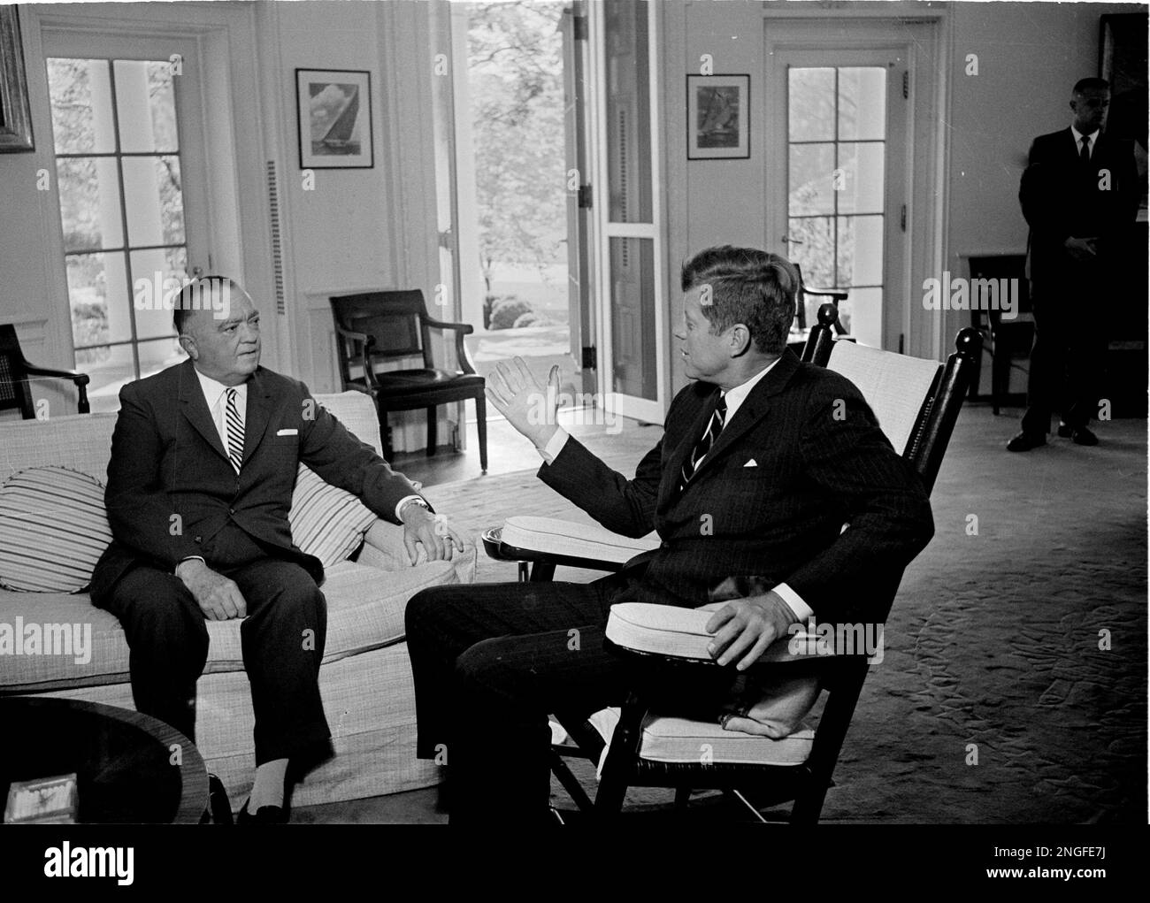 U.S. President John F. Kennedy, sitting in his rocking chair, meets ...